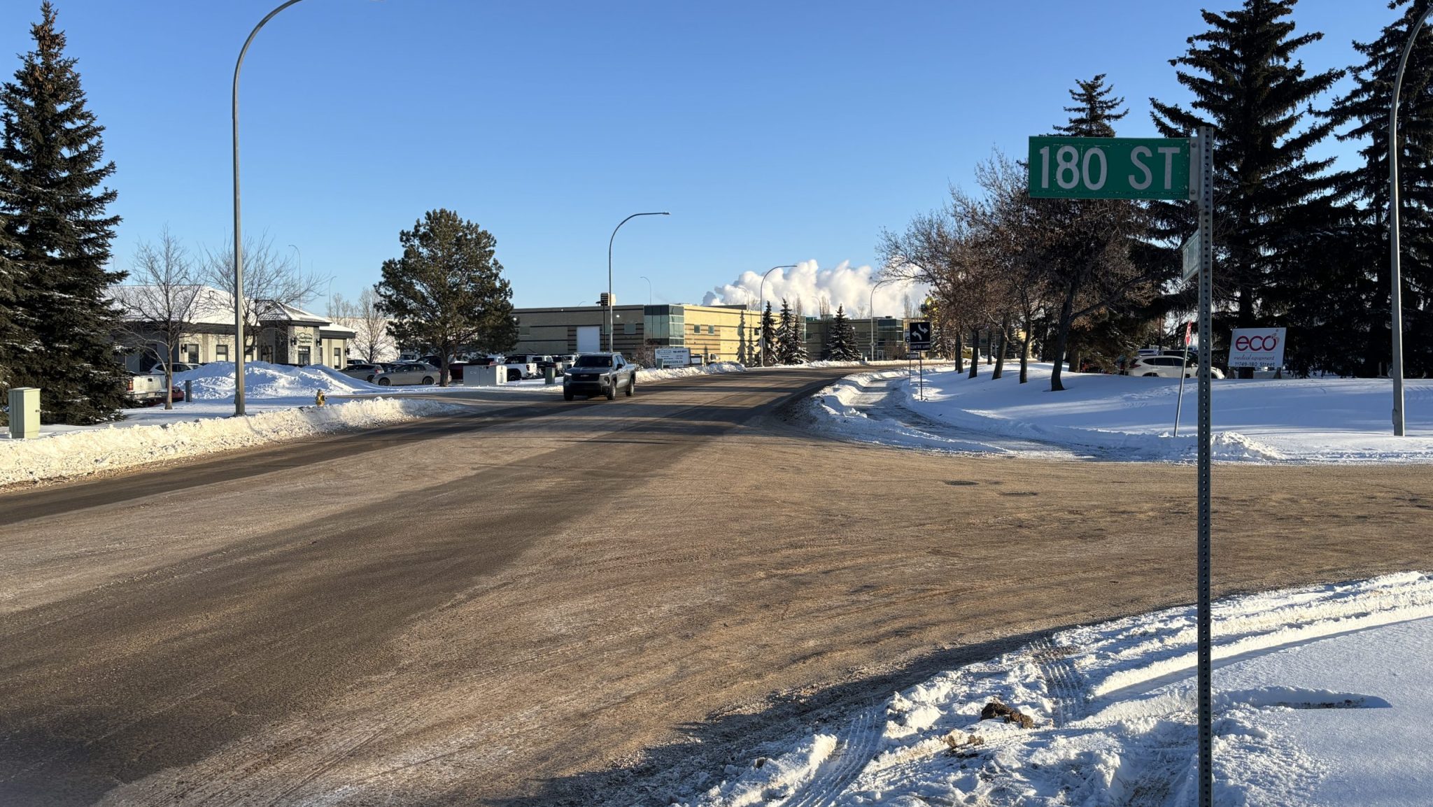 Woman, 32, dead after SUV collides with car hauler in west Edmonton: police