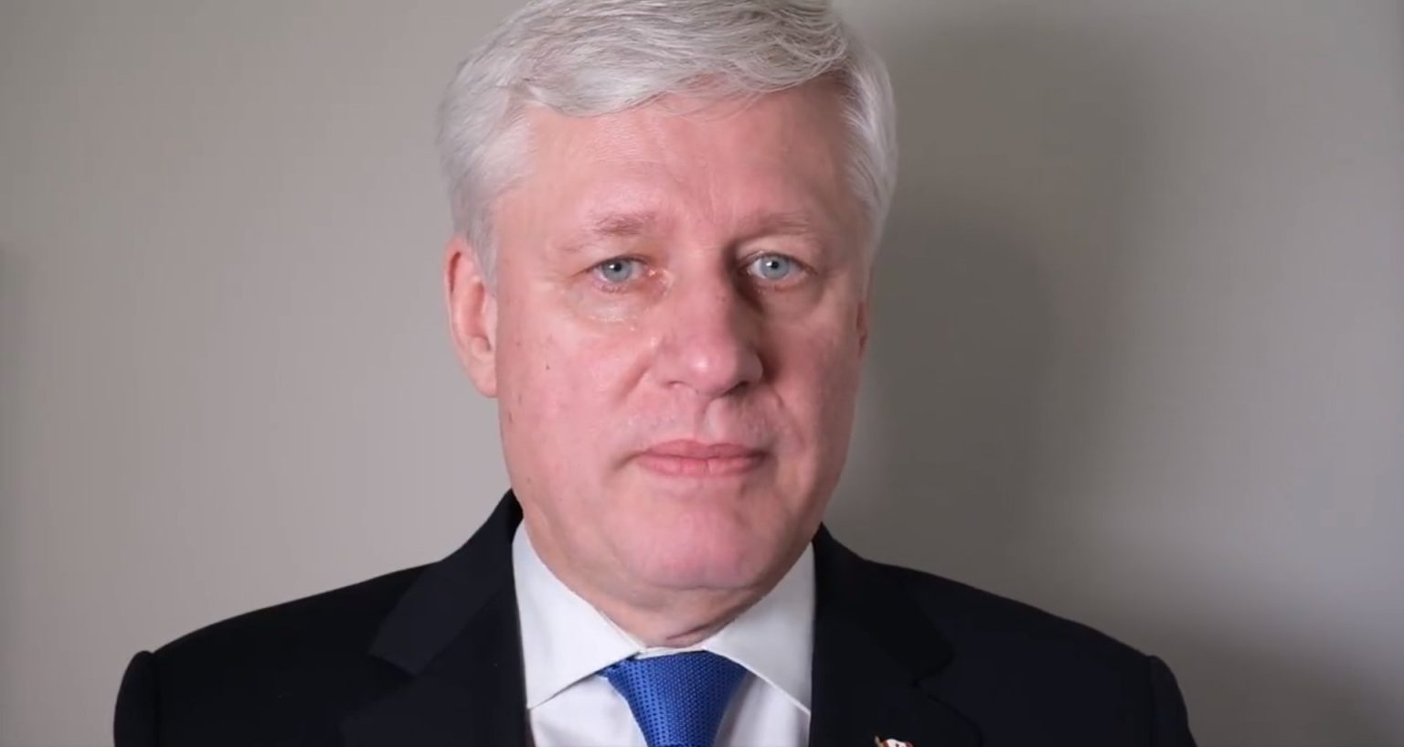 Former prime minister Stephen Harper backs Smith with video message