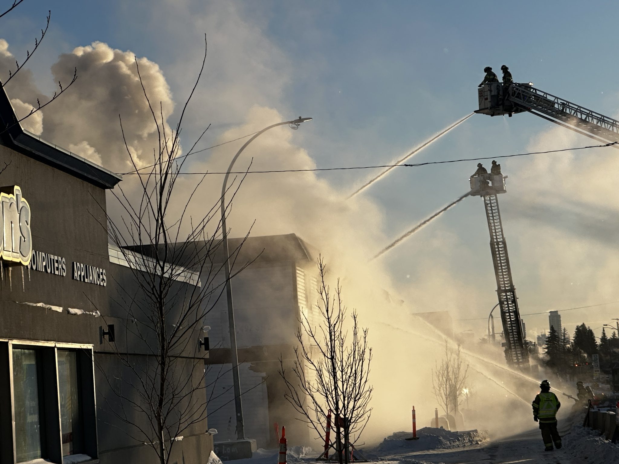 Edmonton firefighters working to put out blaze at Jasper Place Hotel